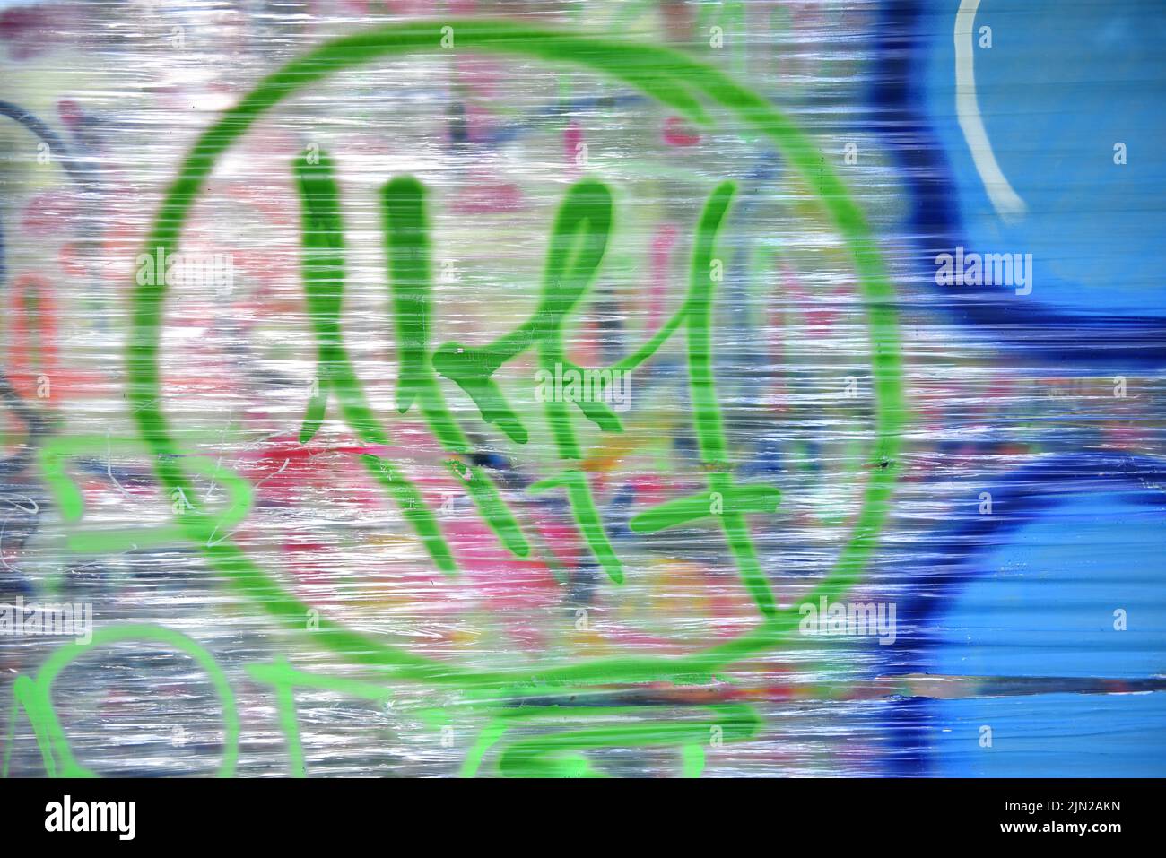 Children's drawings and coloring with paints on plastic wrapping paper ...