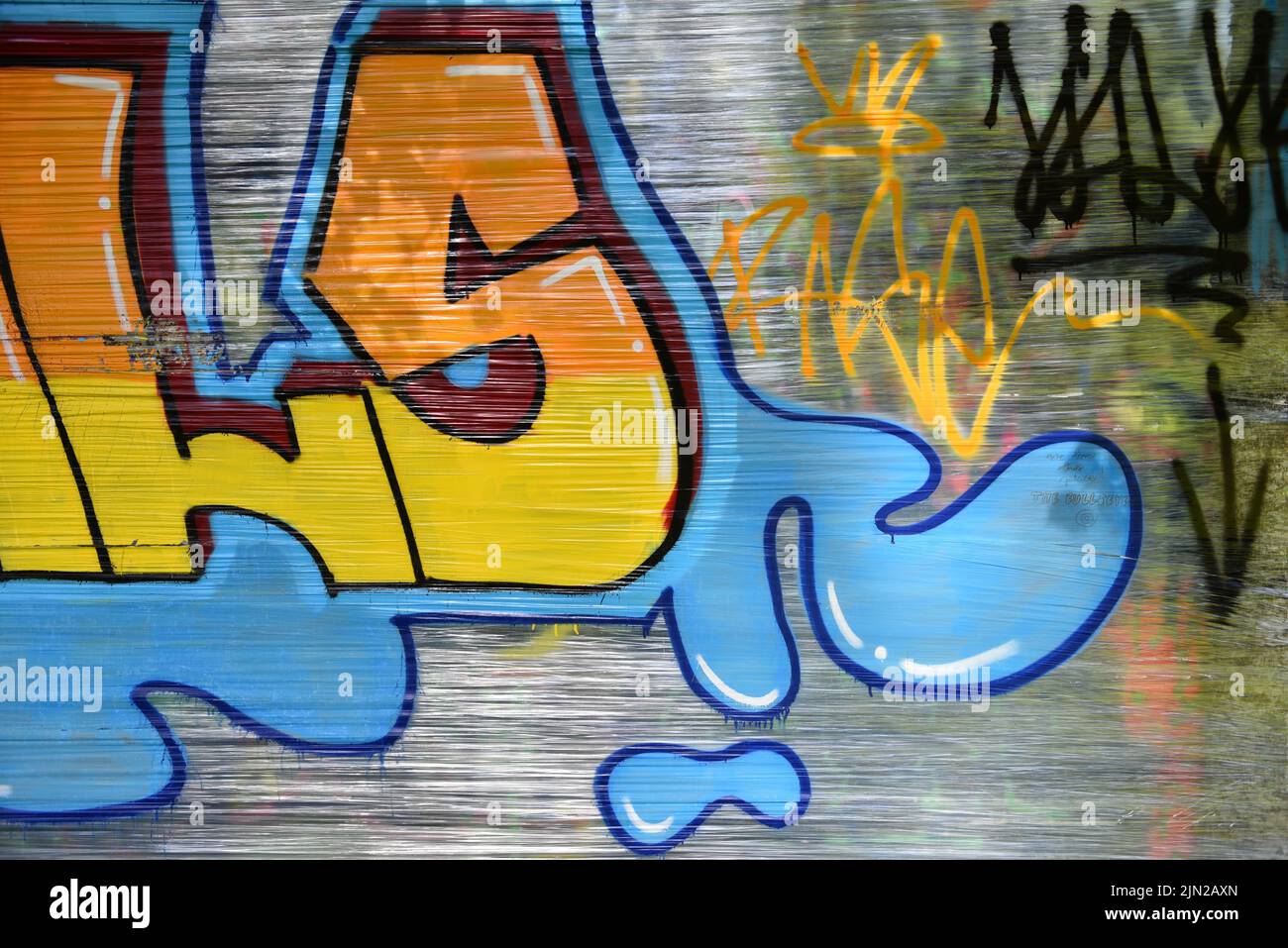 Children's drawings and coloring with paints on plastic wrapping paper ...