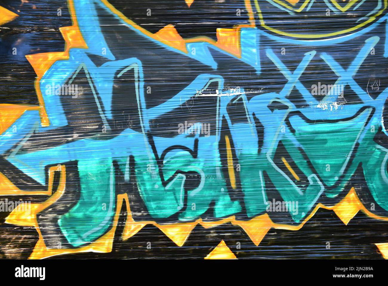 Children's drawings and coloring with paints on plastic wrapping paper ...