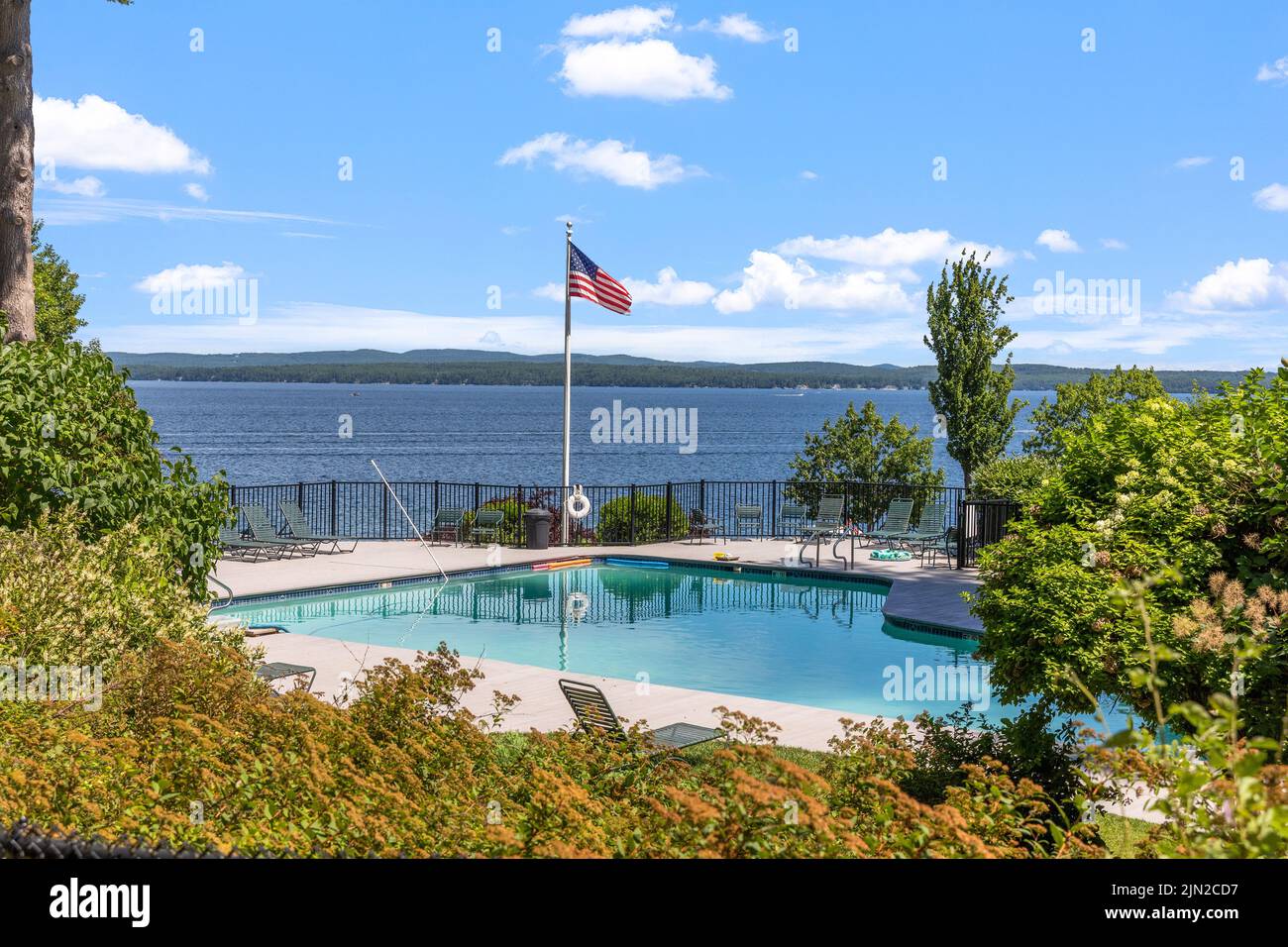 A swimming pool overlooking Lake Winnipesaukee in New Hampshire, USA ...