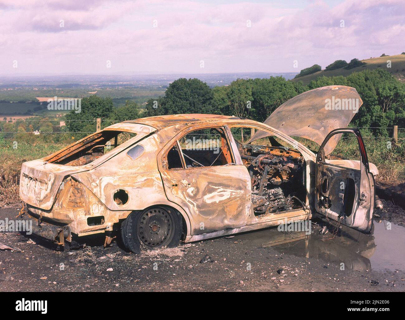 Burnt out saloon car, Sussex, UK Stock Photo - Alamy