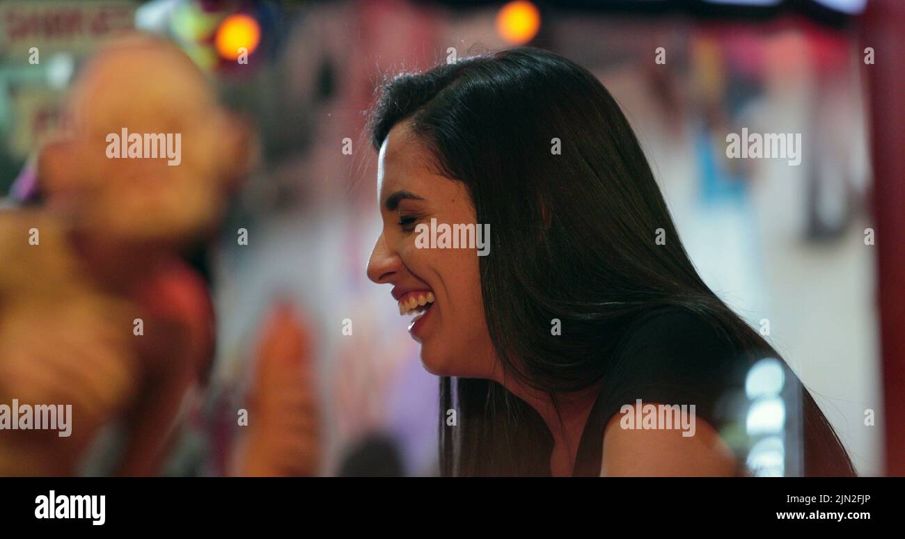 Night scene of Candid casual young women talking to person off-camera ...