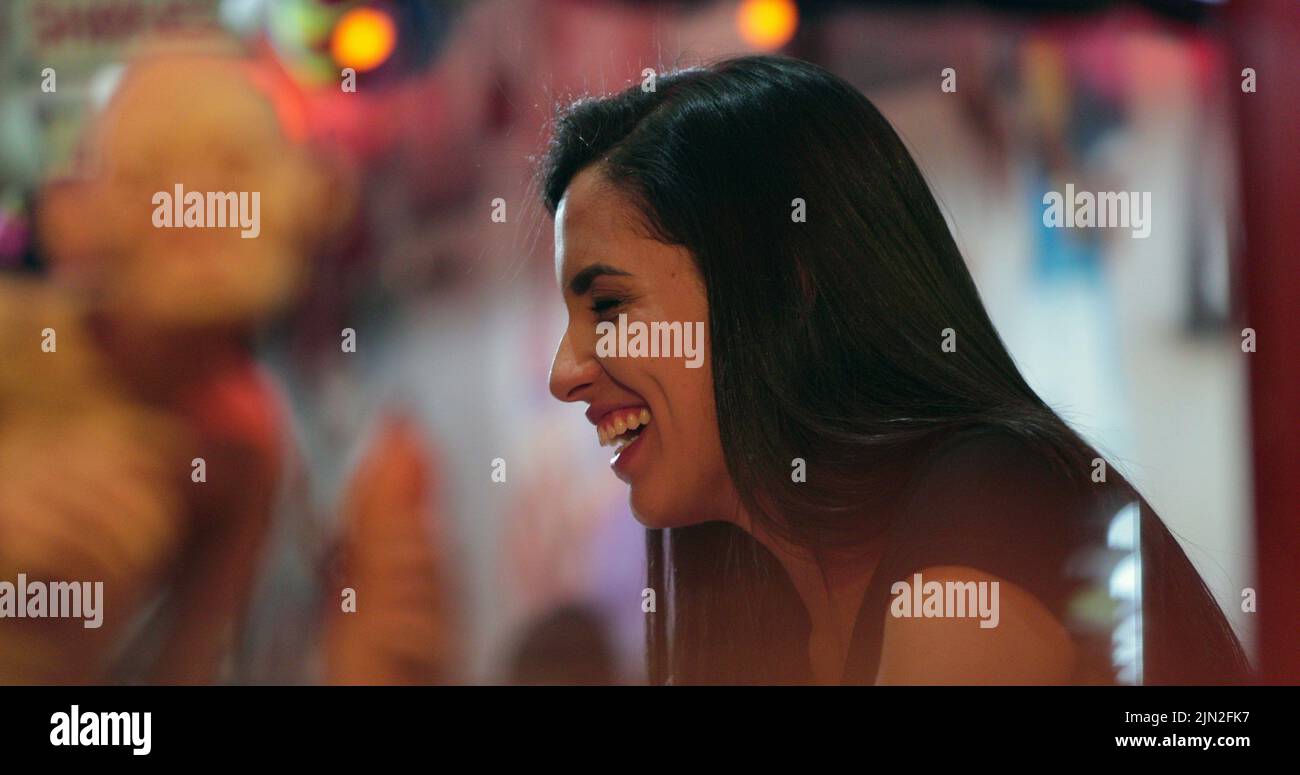Night scene of Candid casual young women talking to person off-camera ...