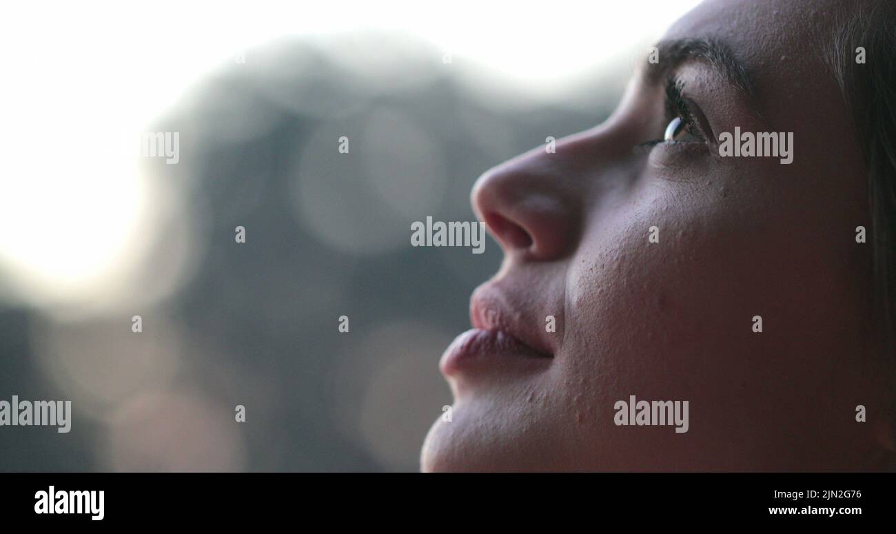 Young woman face opening and closing eyes. Girl meditating and in ...