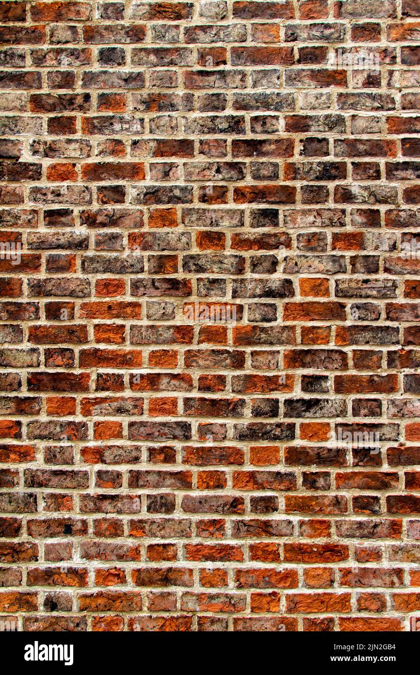 Full frame texture background of a European red color brick wall with a ...