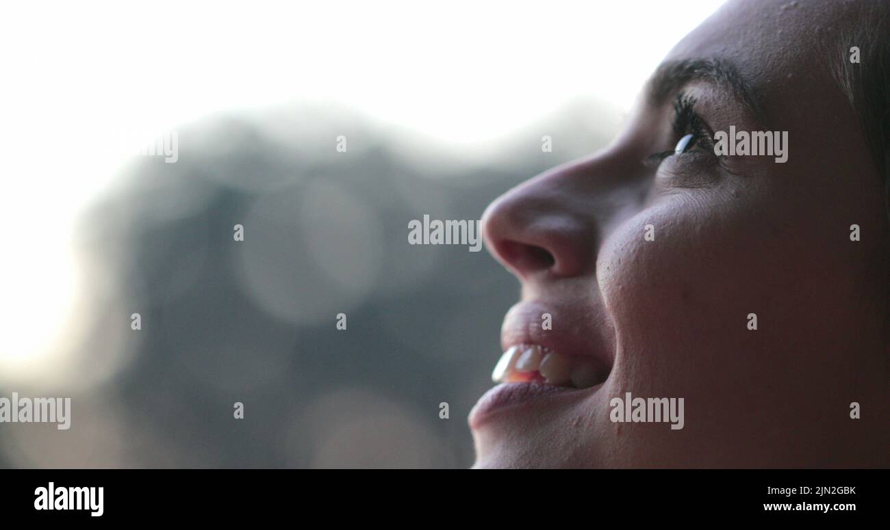 Young woman face opening and closing eyes. Girl meditating and in ...