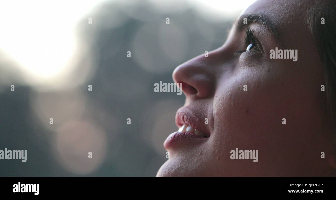 Young woman face opening and closing eyes. Girl meditating and in ...