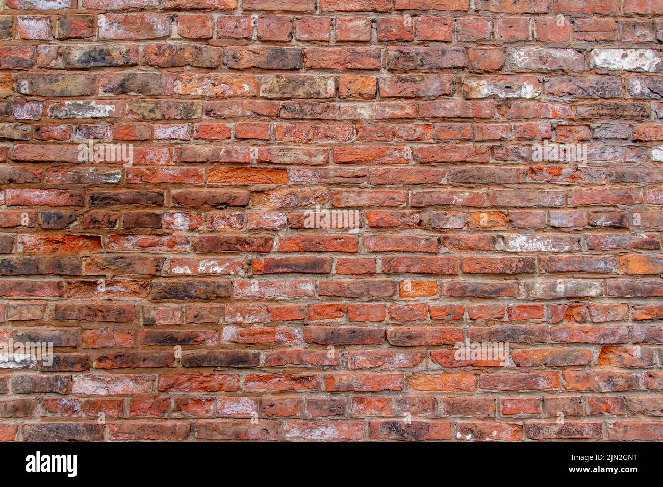 Full frame texture background of an old European red and brown brick ...