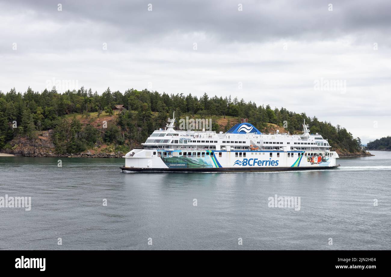 BC Ferries Boat in Pacific Ocean during cloudy summer day Stock Photo ...