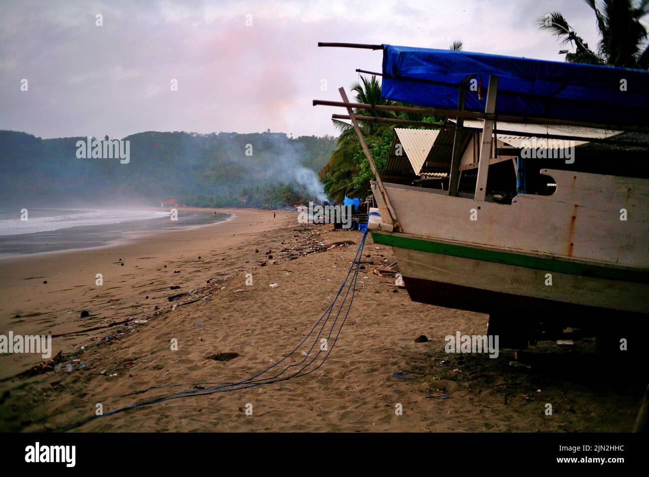 Boat parking on dirty sandy beach Stock Photo - Alamy