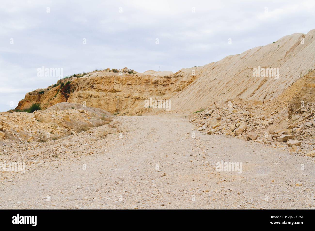 Ruins in a quarry. Dumps of clay and crushed stone in a quarry ...