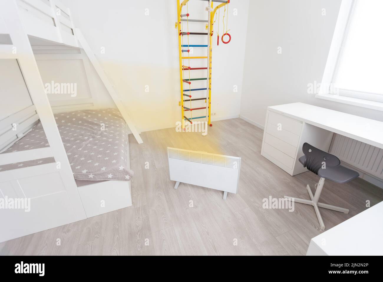 Modern electric heater in stylish room interior Stock Photo - Alamy