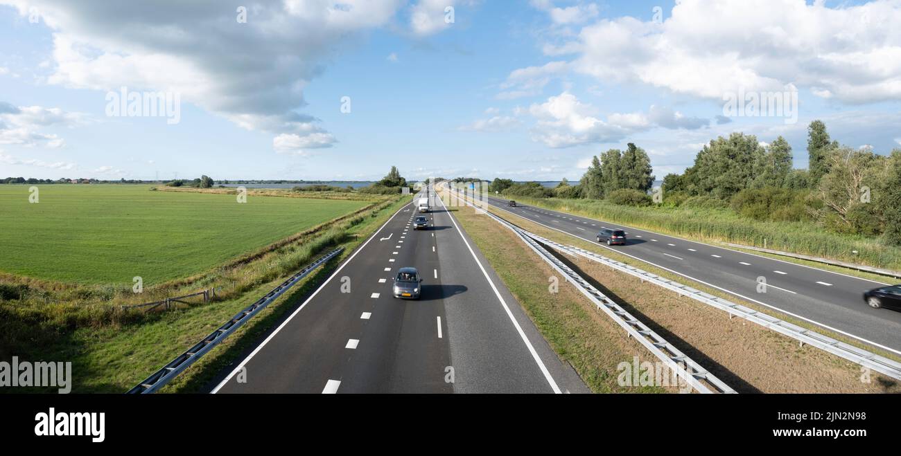 Highway A6 with traffic near Oosterzee between Joure and Lemmer in the ...