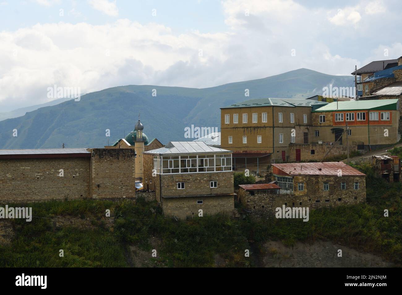 Picturesque Chokh town with old brick buildings on hill steep slope ...