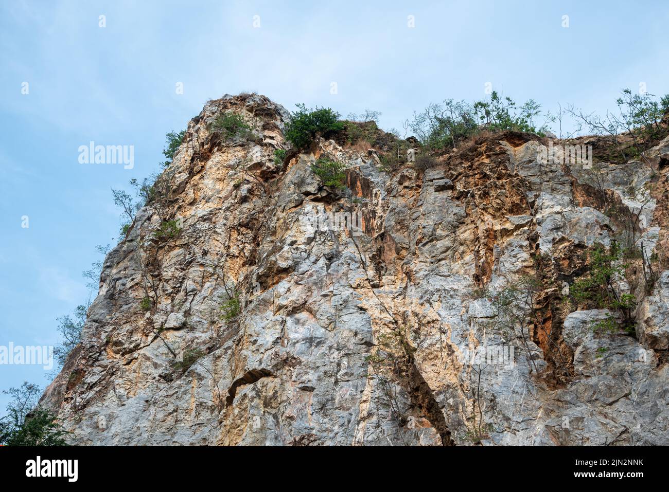 Rock mountain scene and blue sky background Stock Photo - Alamy