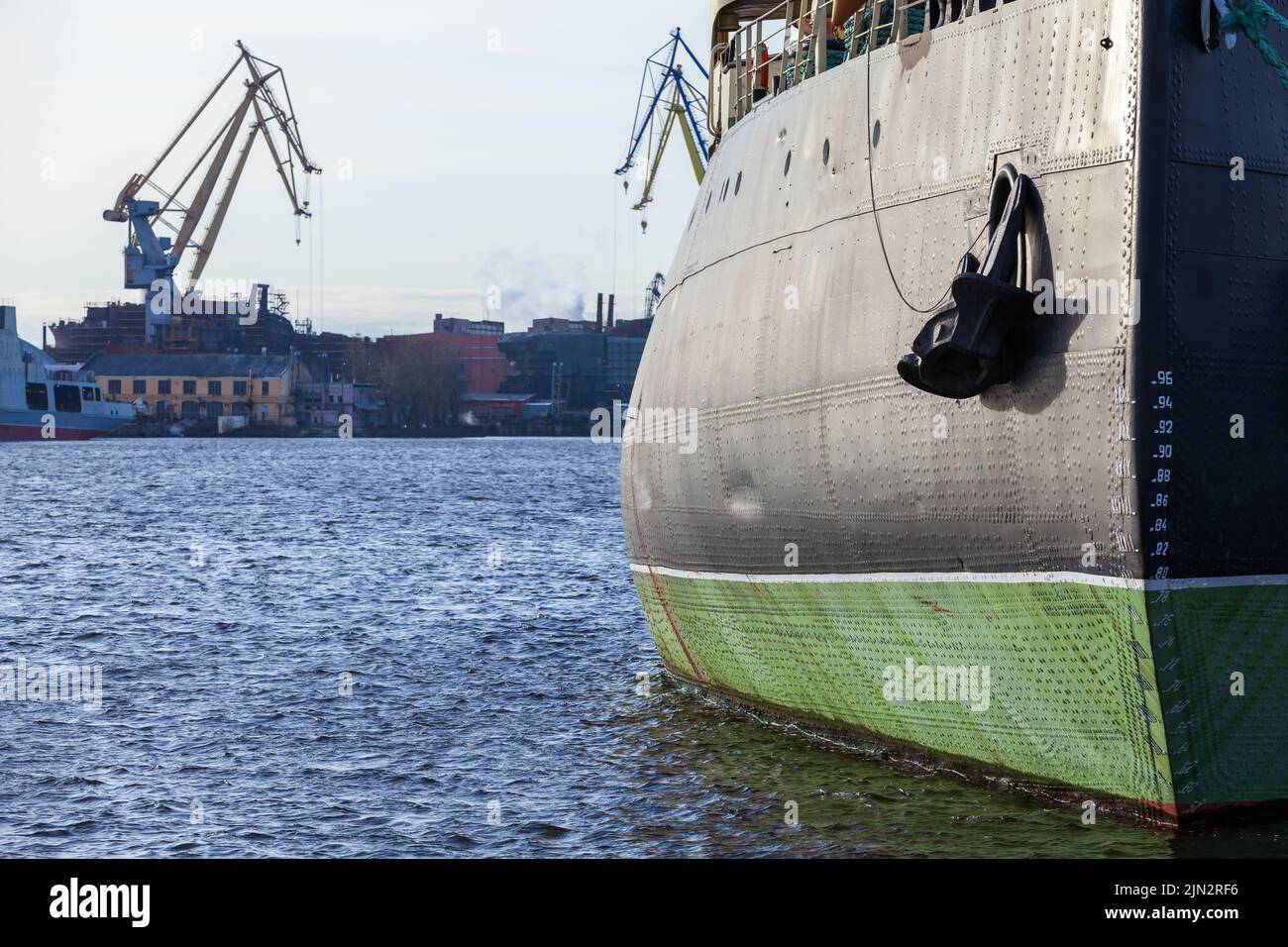 Black hull with an anchor of vintage icebreaker ship moored in St ...