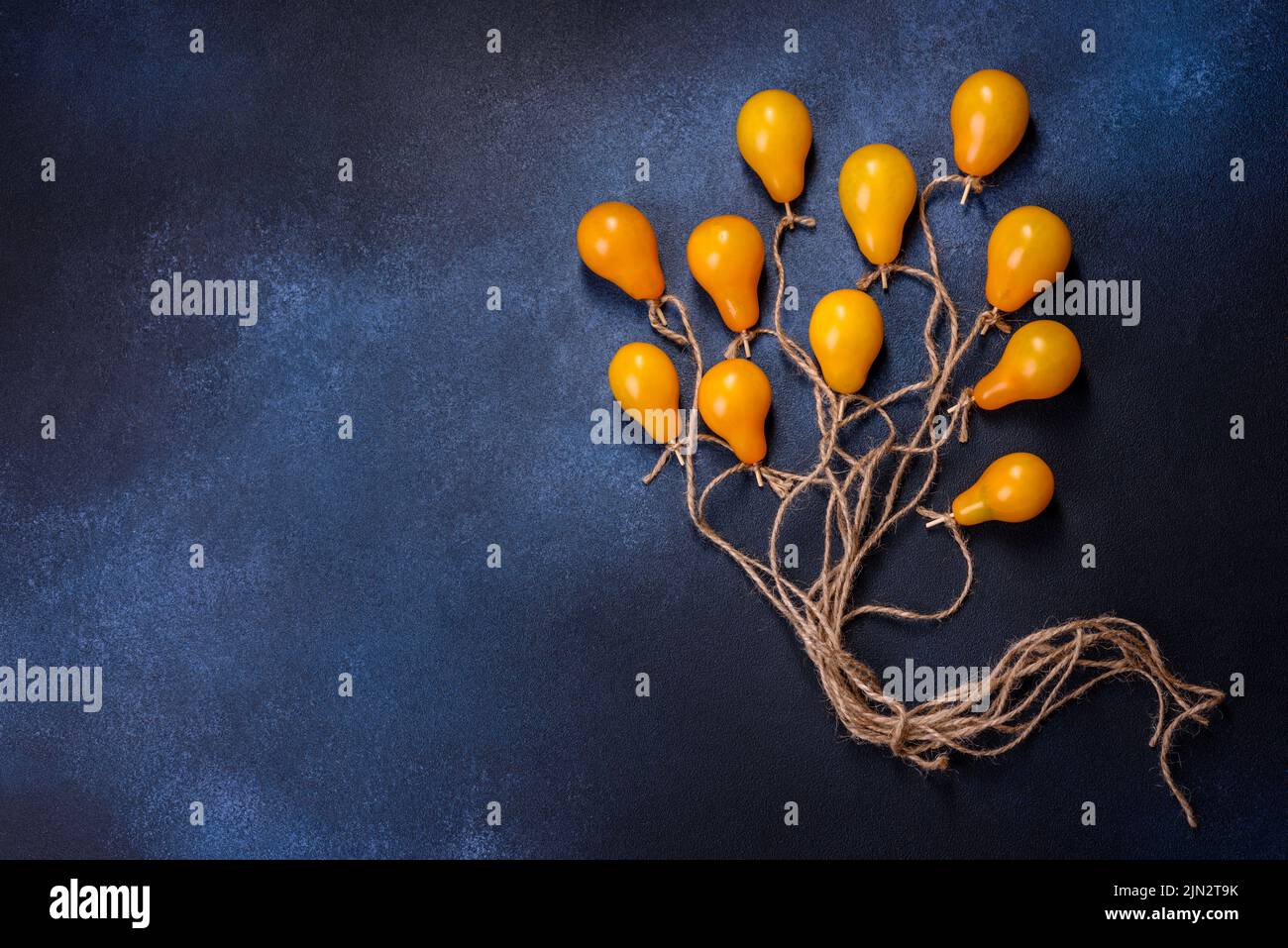 The concept idea in the form of balloons on ropes is made of yellow ...