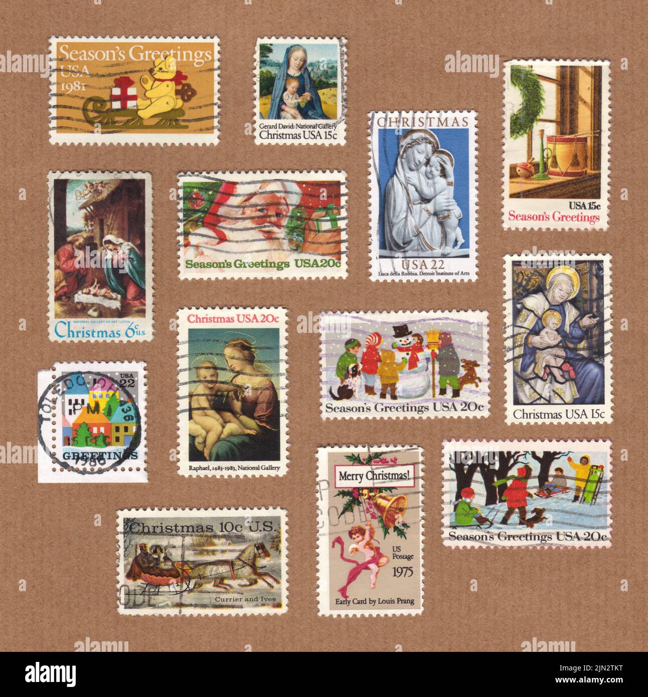 Collection of vintage US Postal Mail Service Christmas stamps, on a ...