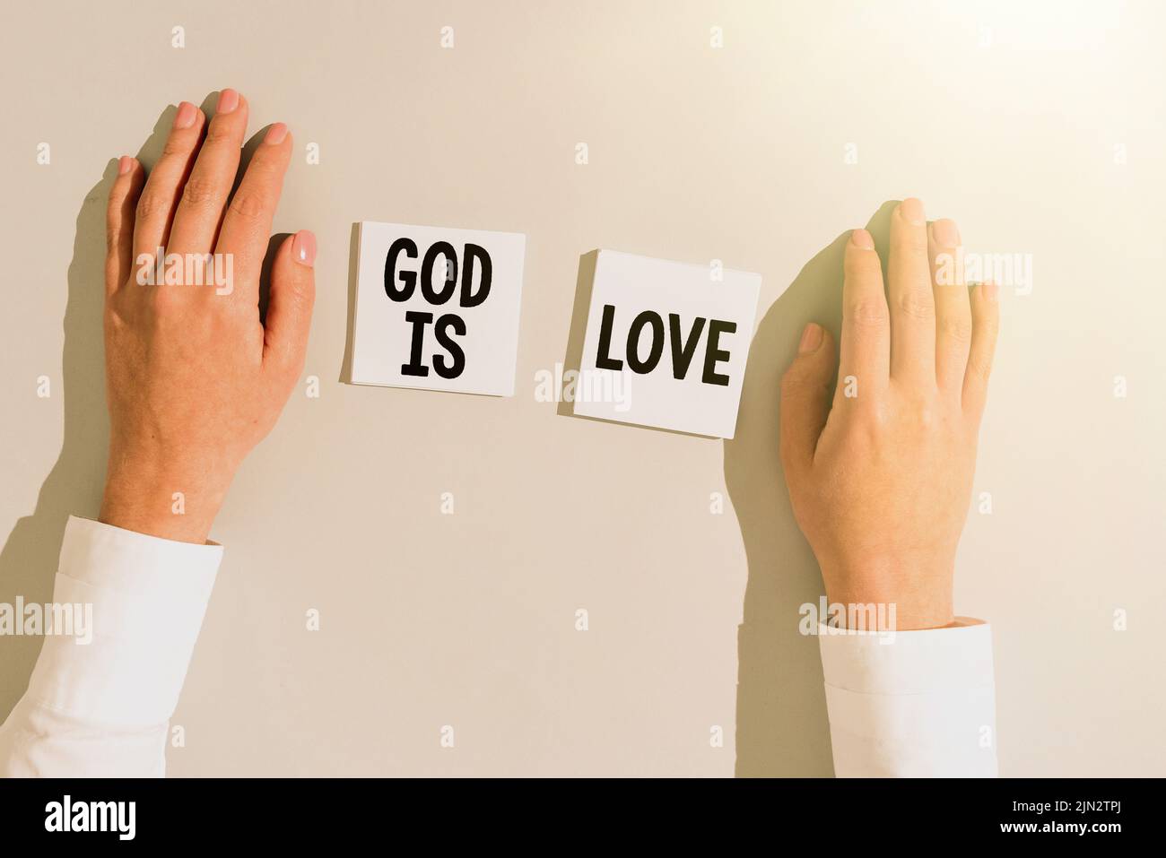 Sign displaying God Is Love. Internet Concept Believing in Jesus having ...
