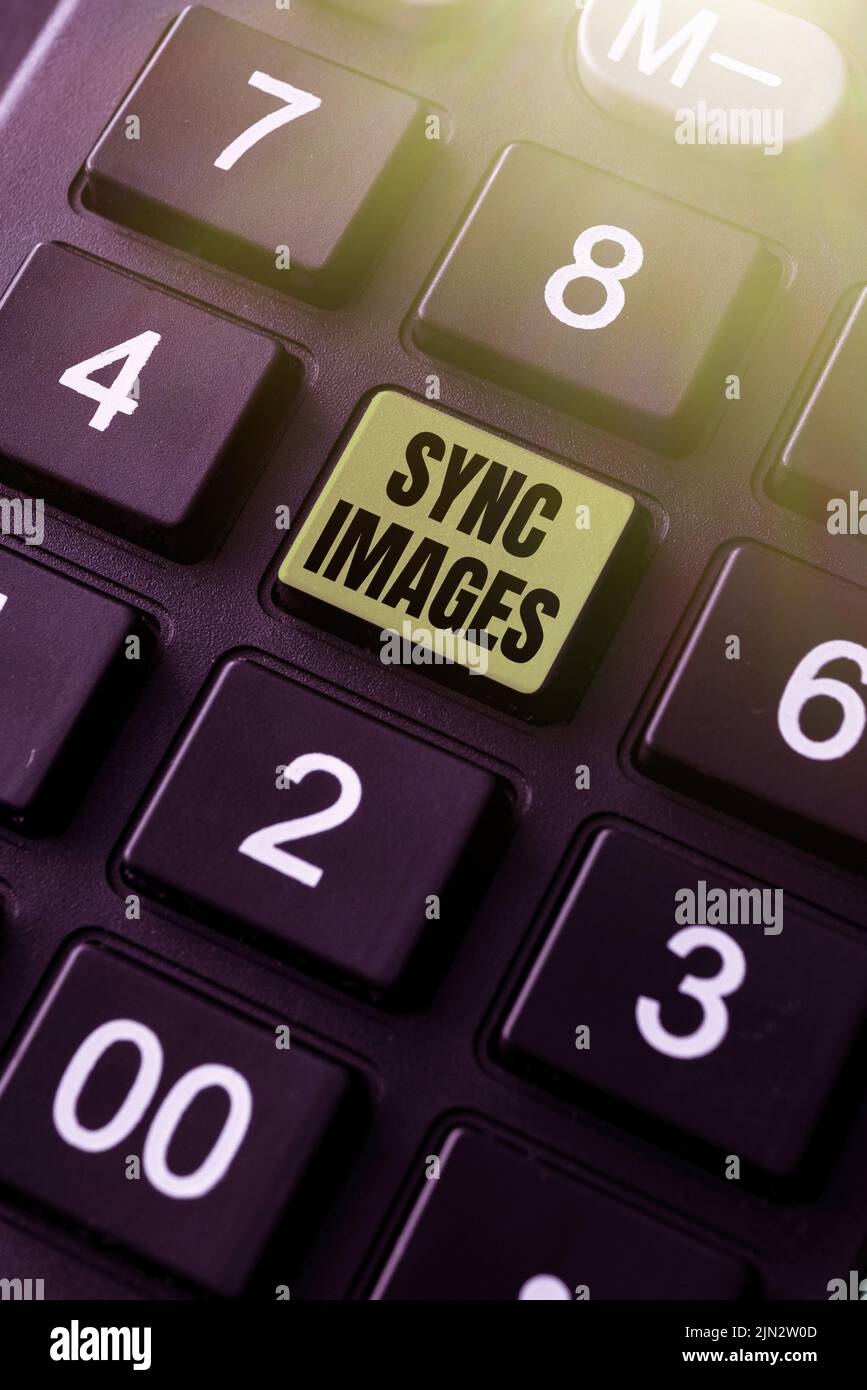 Sign displaying Sync Images. Conceptual photo Making photos identical ...