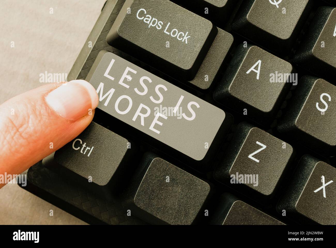 Hand writing sign Less Is More. Business showcase Minimalist approach ...