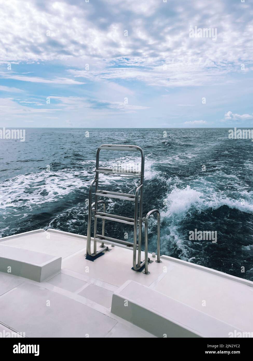 View on the ocean from a yacht stern Stock Photo - Alamy