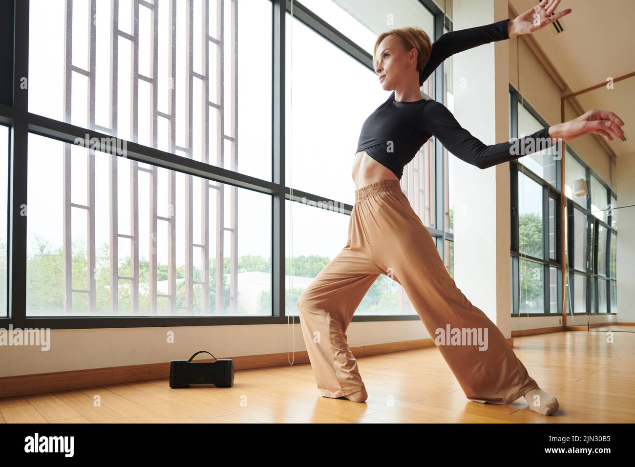 Fit young woman dancing in studio, rehearsing her performance Stock ...