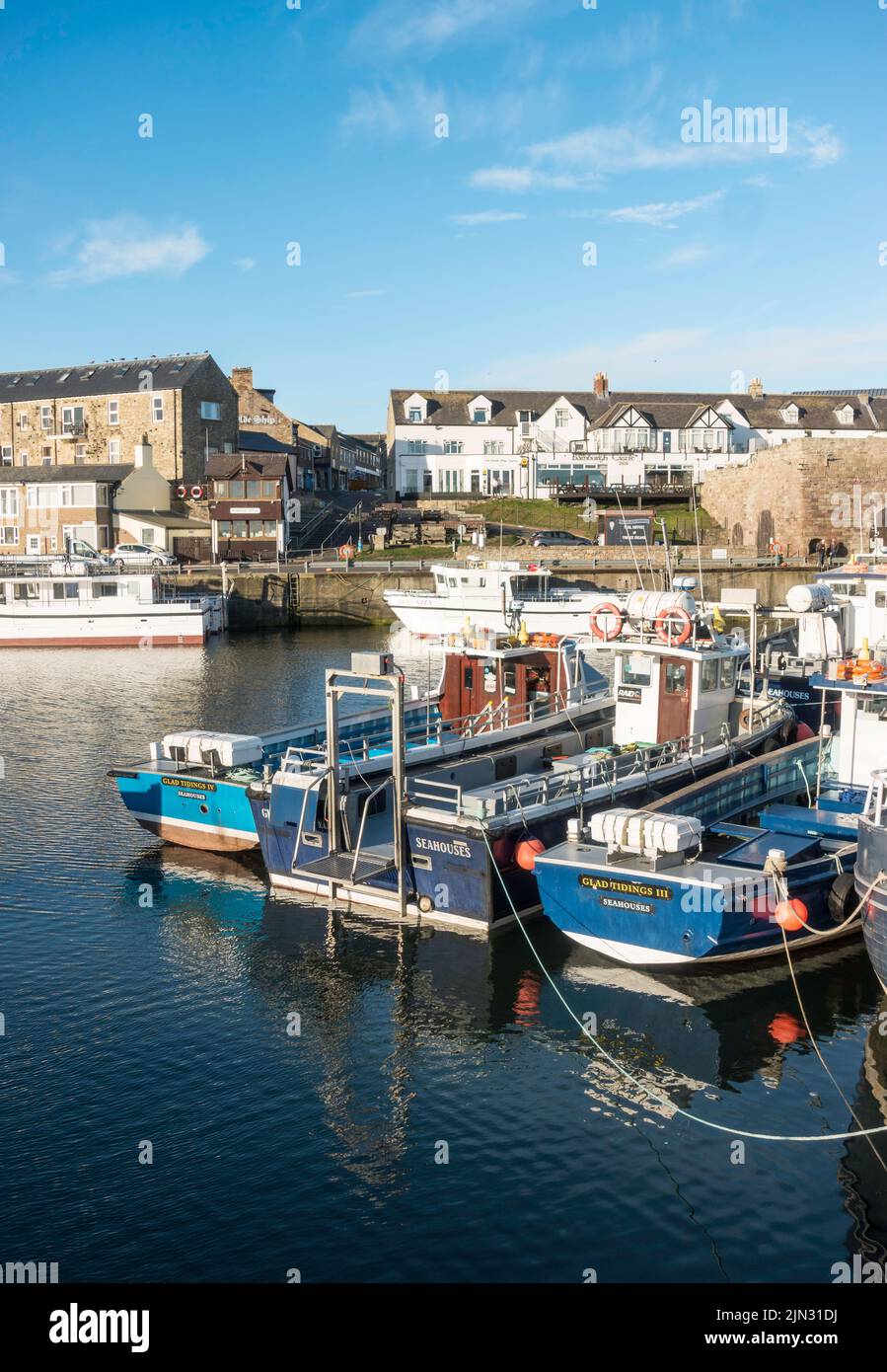 Boats moored in North Sunderland harbour, Seahouses, Northumberland ...