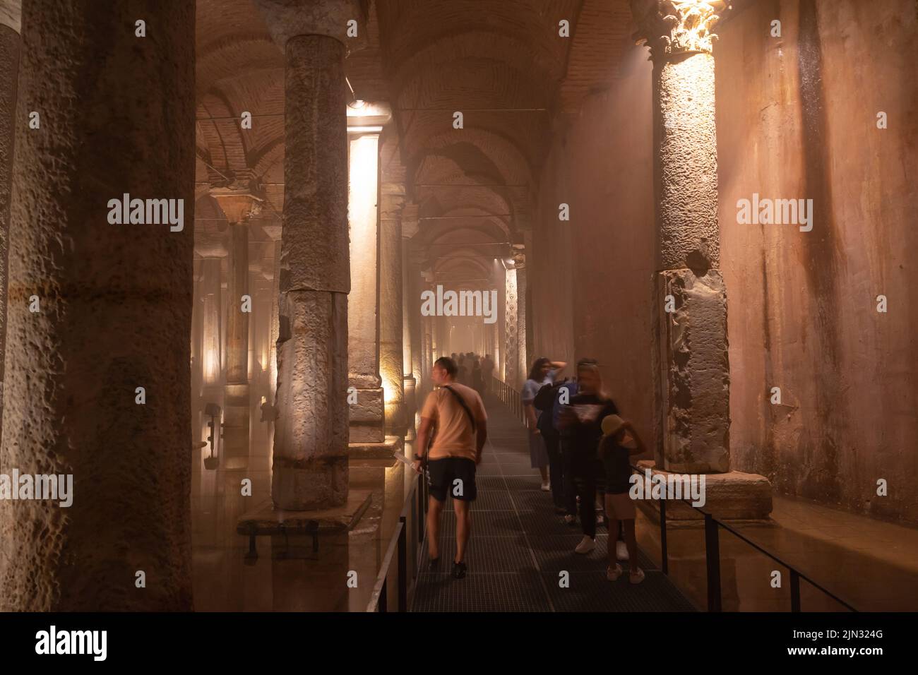 Tourists in Yerebatan Sarnici or the Basilica Cistern. Noise and grain included. Selective focus ...