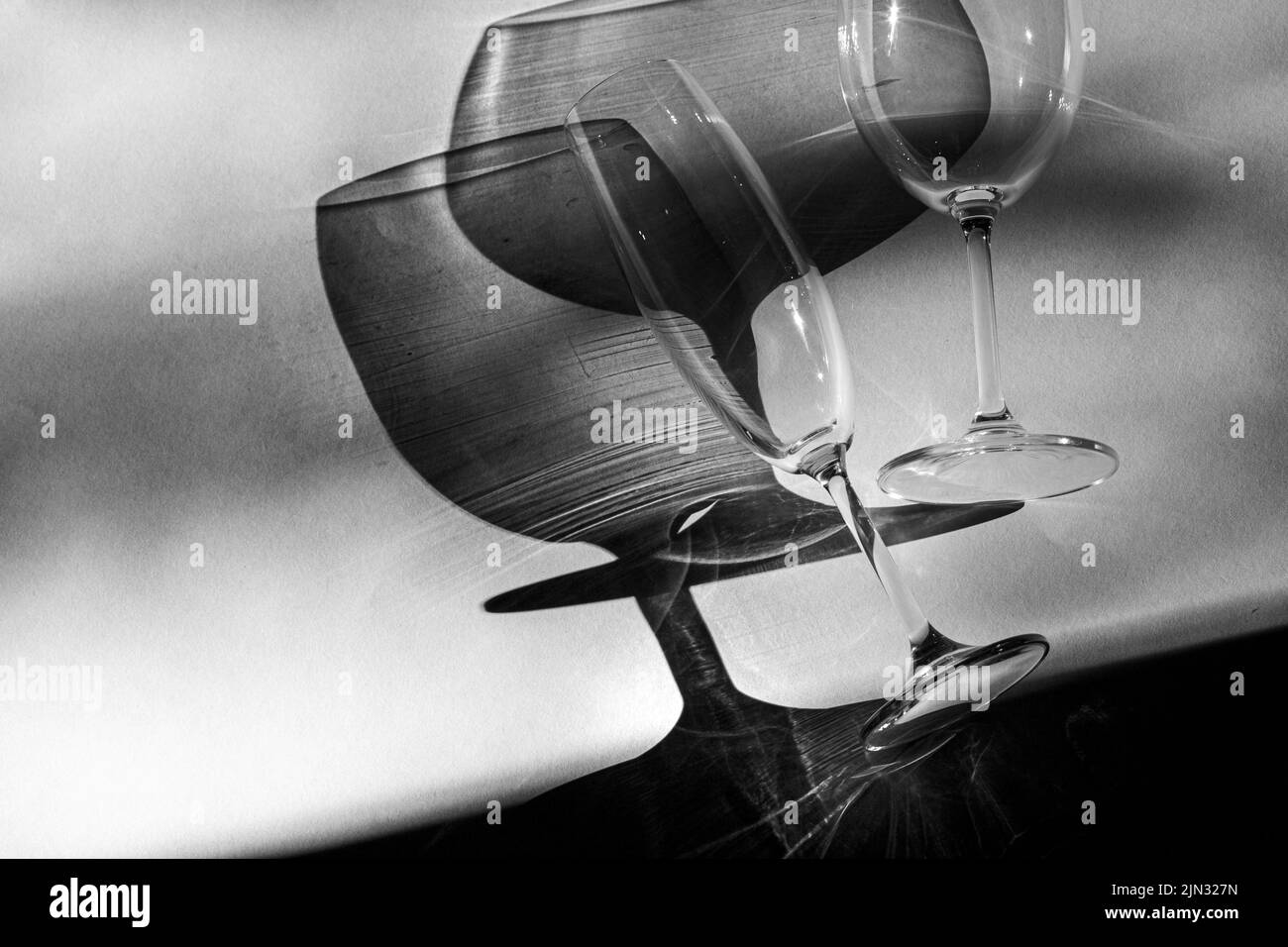 Wine glasses casts a beautiful shadow and caustic effect as light ...