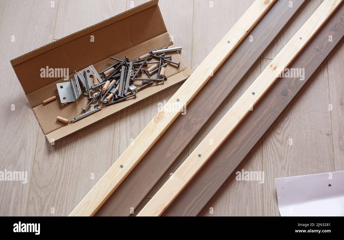 Assembling furniture at home. Home repairs Stock Photo - Alamy