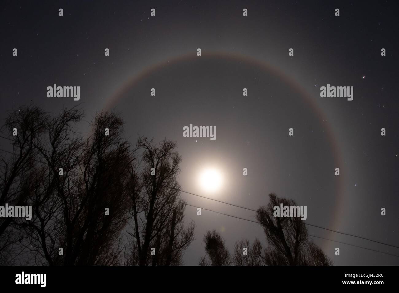 Halo phenomenon on the moon over Ukraine at night during the war in the ...