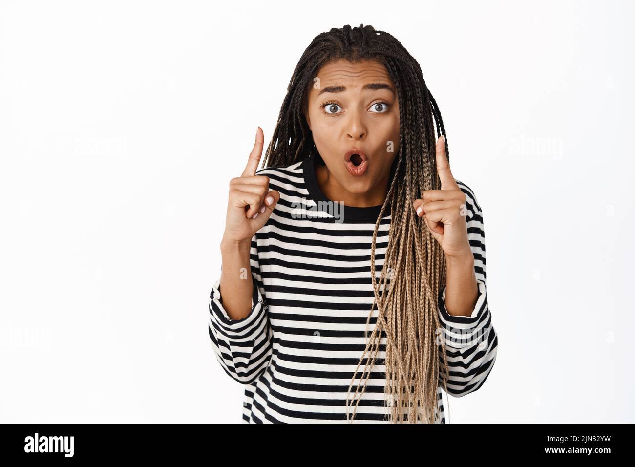 Surprised black girl gasping, say wow, staring impressed at camera ...