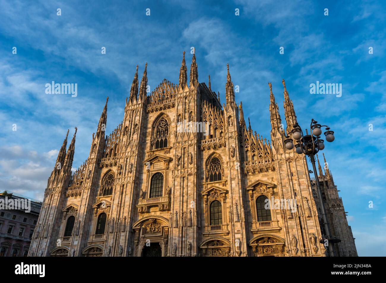 Sunset Scene of The ornate gothic facade, soaring spires and ...
