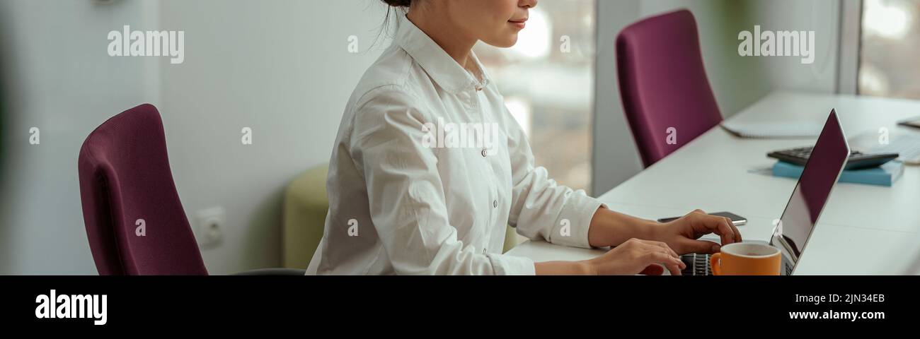 Pretty asian business woman working laptop sitting in modern office ...