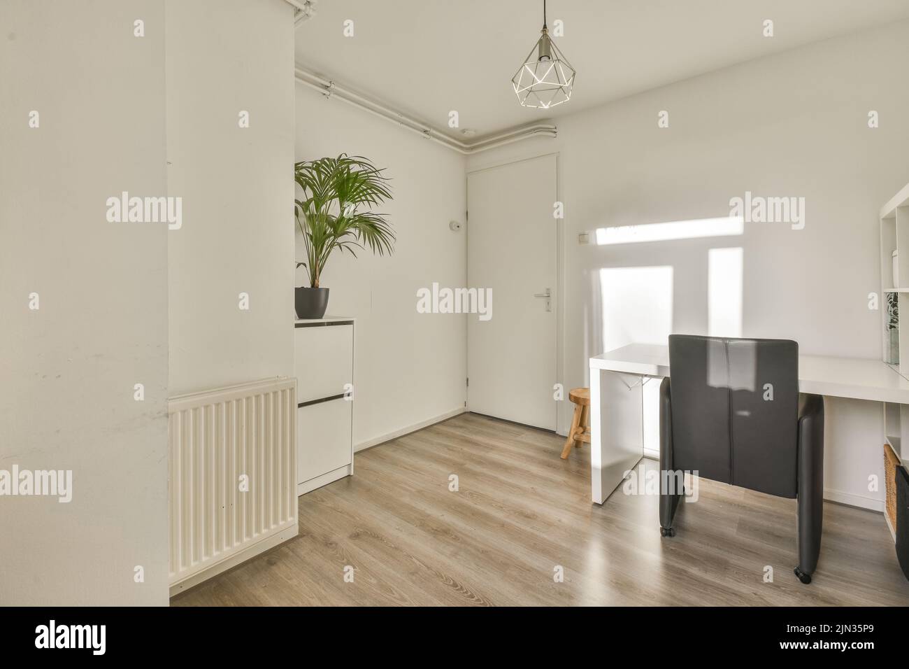 Table with chairs and flowers located near lounge area and kitchen in ...