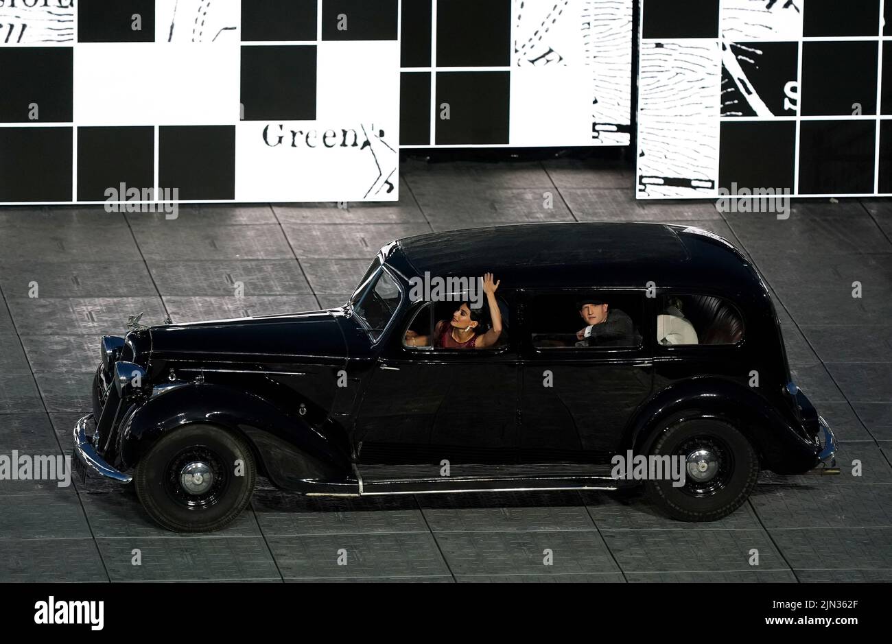 Performers arrive by car for a Peaky Blinders themed segment during the ...