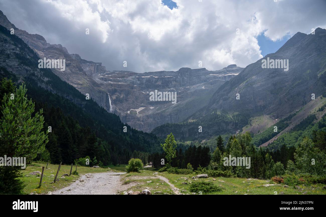 large waterfalls on steep mountain cliffs, Cirque de Gavarnie, Pyrenees ...