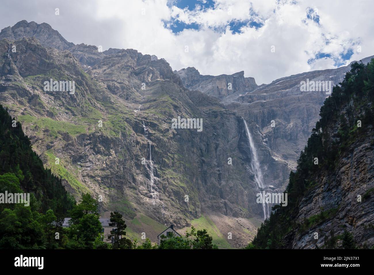 large waterfalls on steep mountain cliffs, Cirque de Gavarnie, Pyrenees ...
