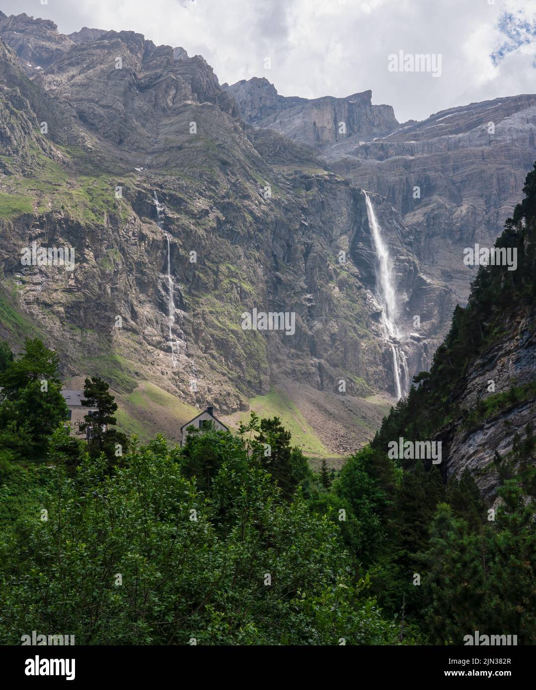 large waterfalls on steep mountain cliffs, Cirque de Gavarnie, Pyrenees ...