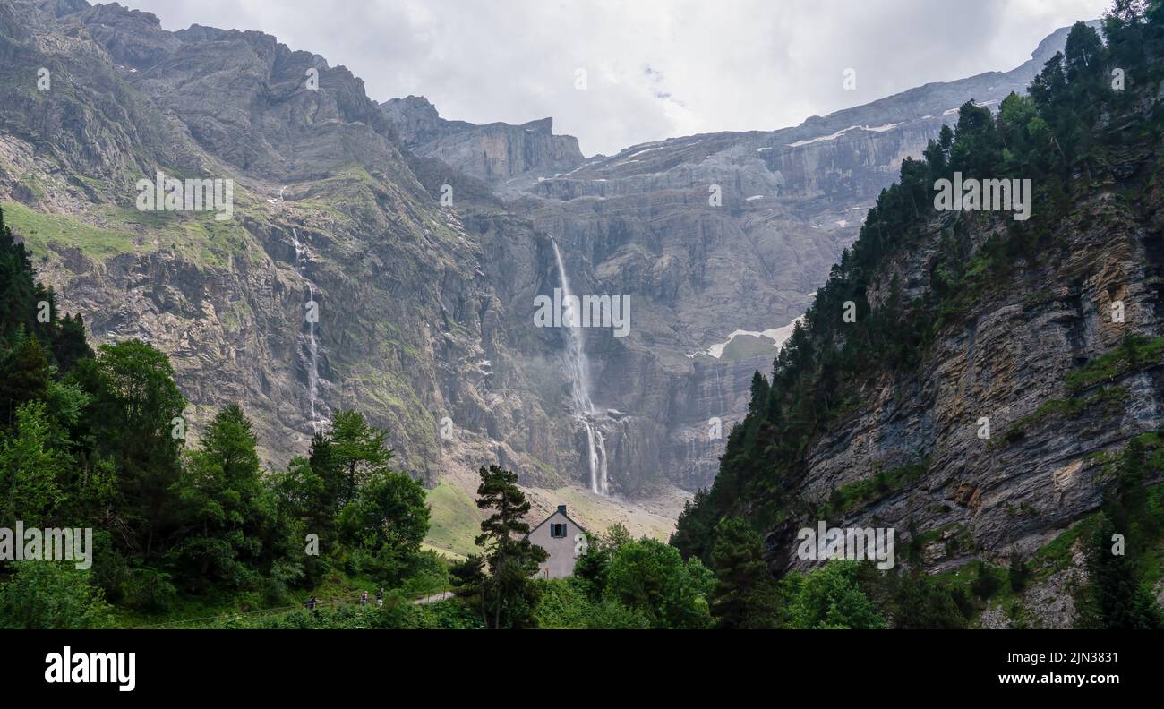 large waterfalls on steep mountain cliffs, Cirque de Gavarnie, Pyrenees ...