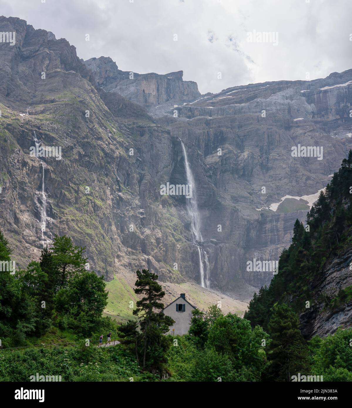 large waterfalls on steep mountain cliffs, Cirque de Gavarnie, Pyrenees ...