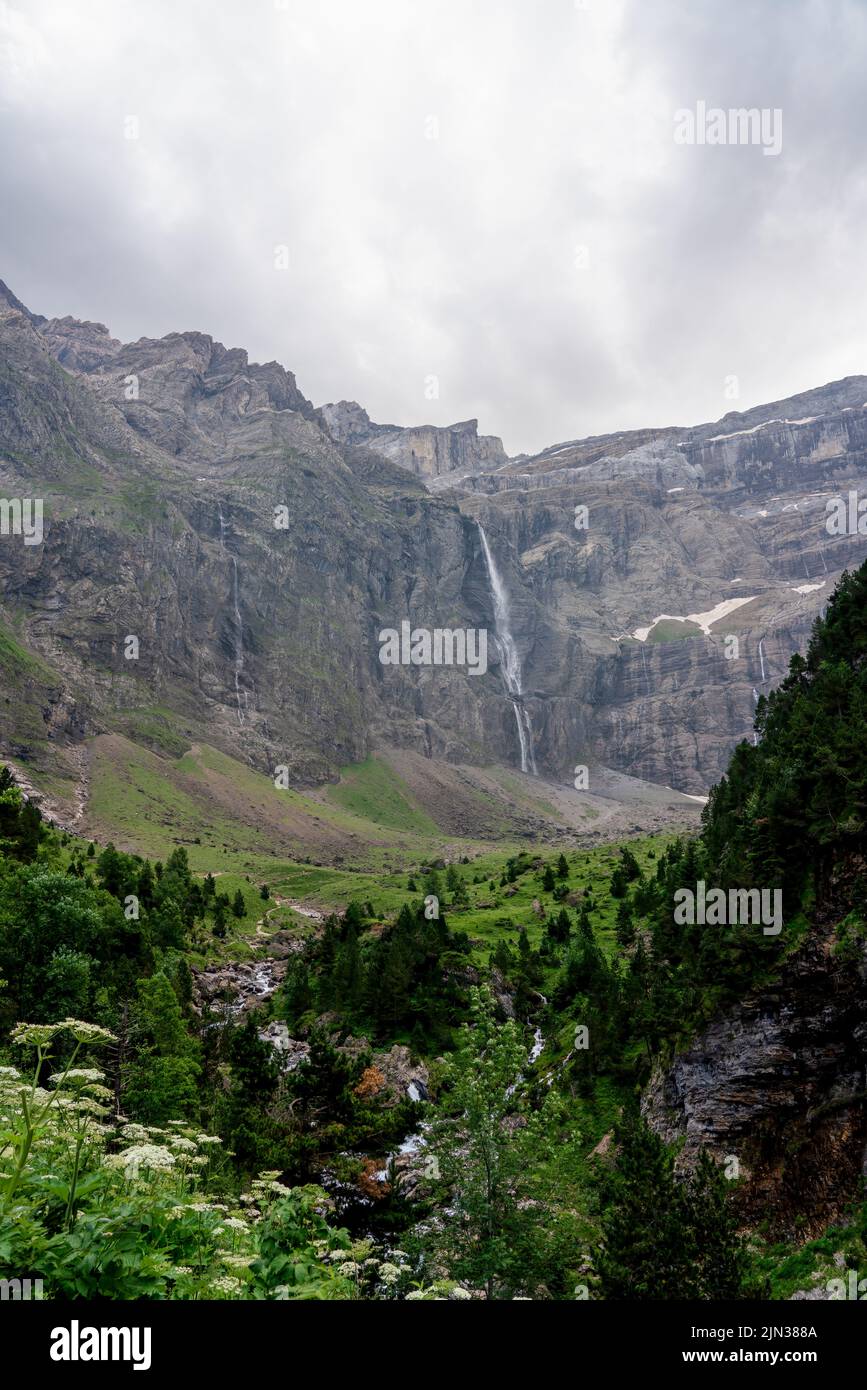 large waterfalls on steep mountain cliffs, Cirque de Gavarnie, Pyrenees ...