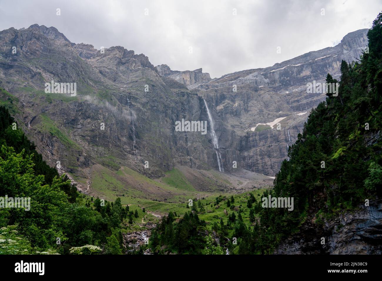 large waterfalls on steep mountain cliffs, Cirque de Gavarnie, Pyrenees ...
