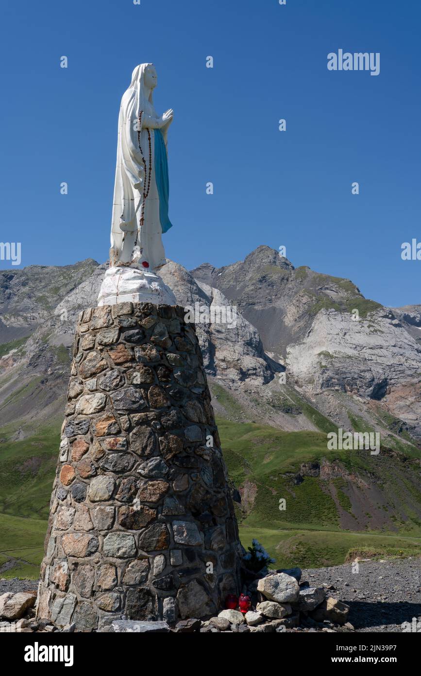 virgin Mary statue, the Cirque de Troumouse (Pyrenees) with clear blue ...