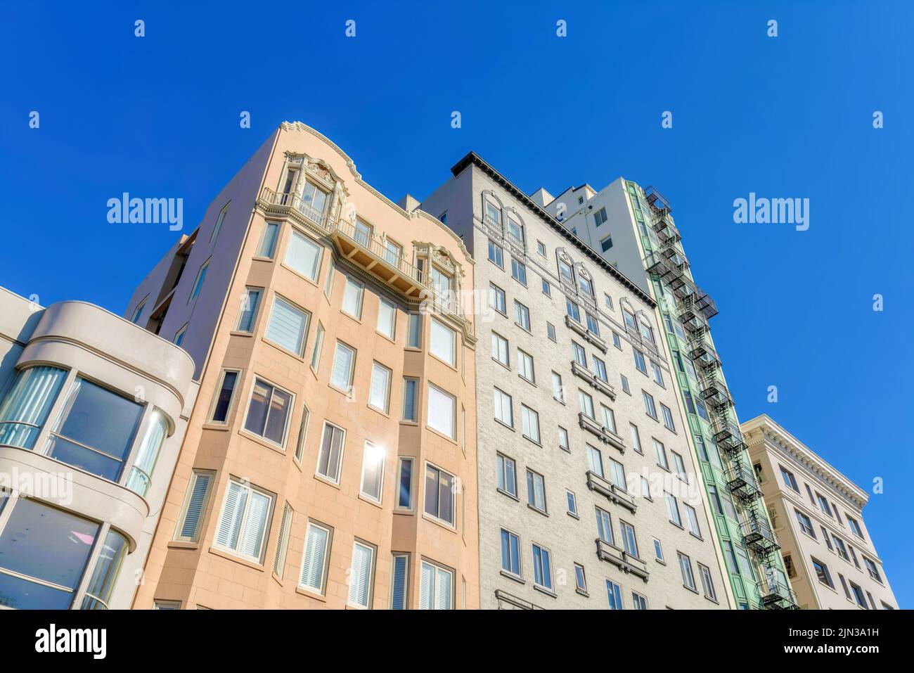 Low rise, mid rise, and high rise apartment buildings in a low angle ...