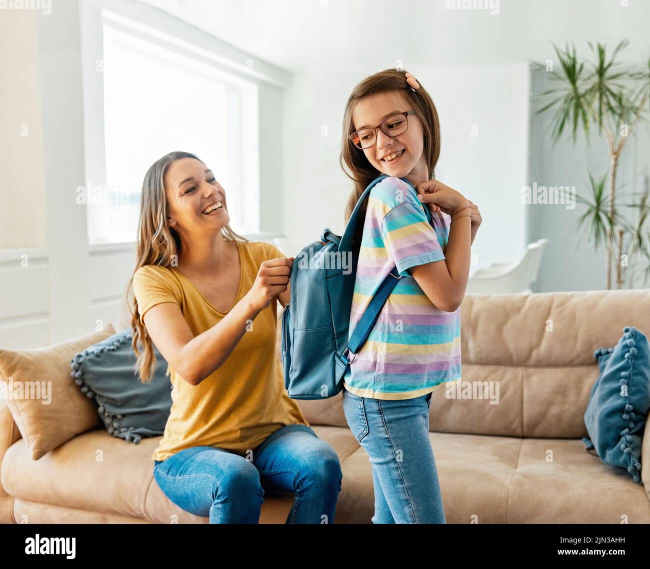 child mother family education school girl home daughter backpack help ...