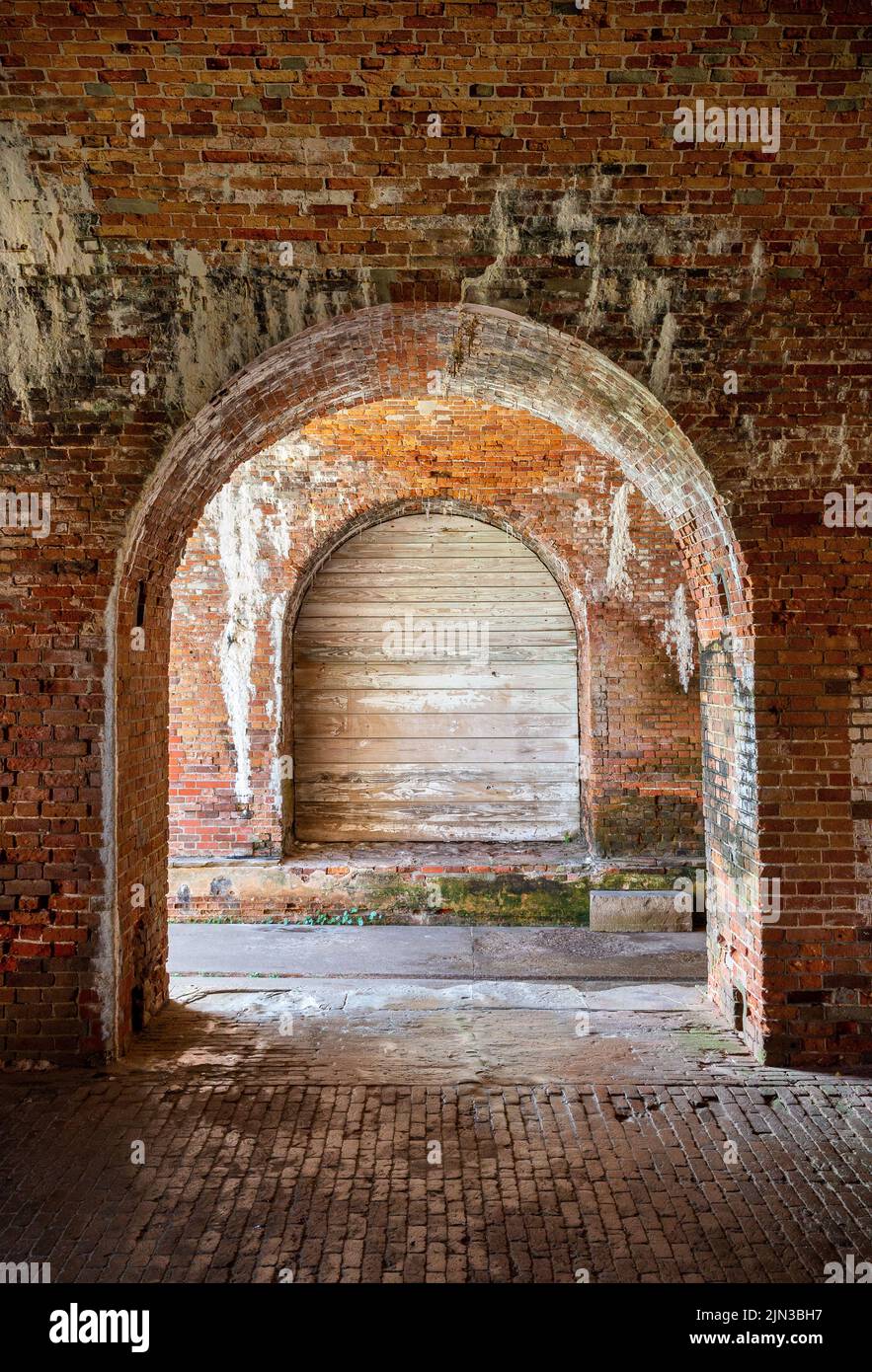 Nested arched doorways leading to a white wooden door. Significant ...