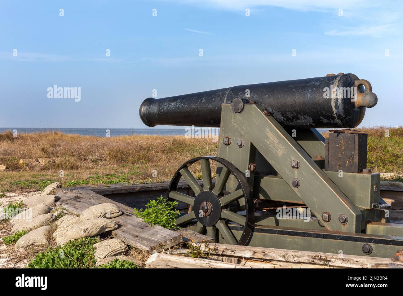 Cannon outside of historic Fort Morgan in Alabama. Copy space in sky if ...