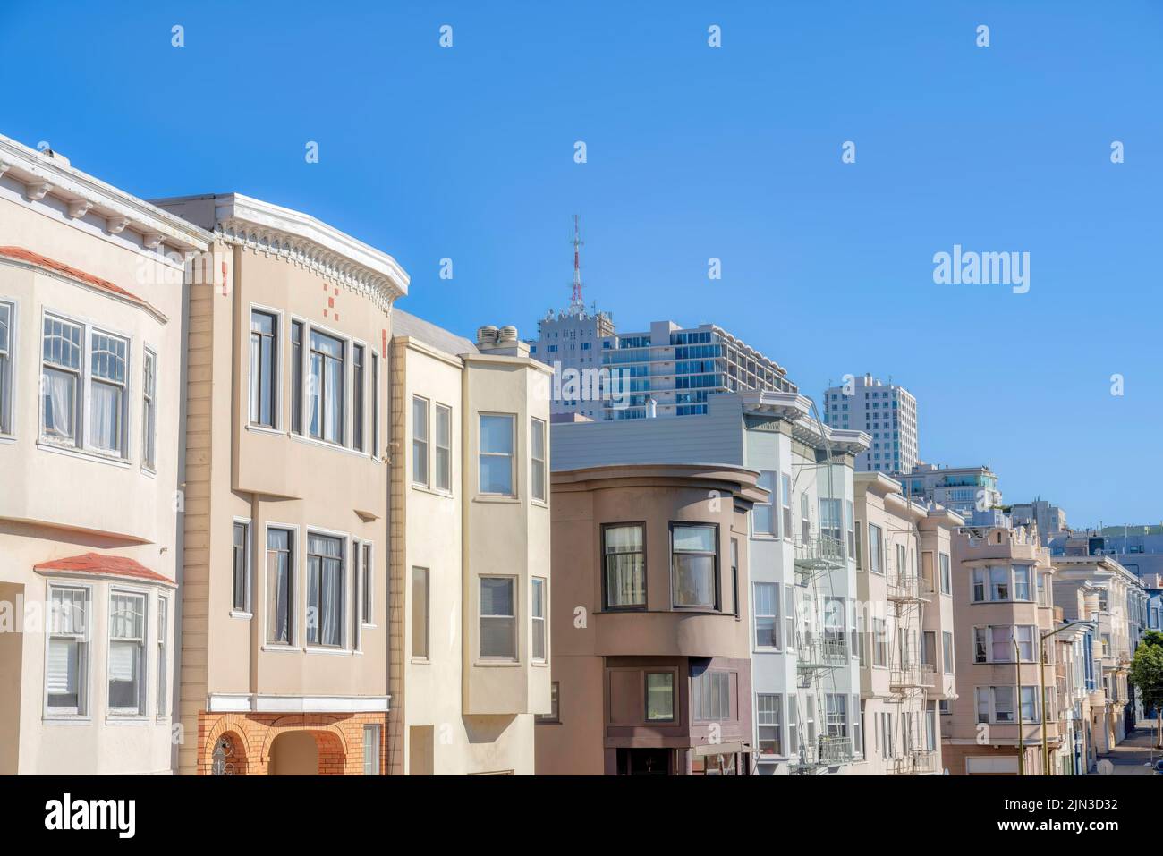 Row of apartments in San Francisco, CA near the commercial buildings at ...